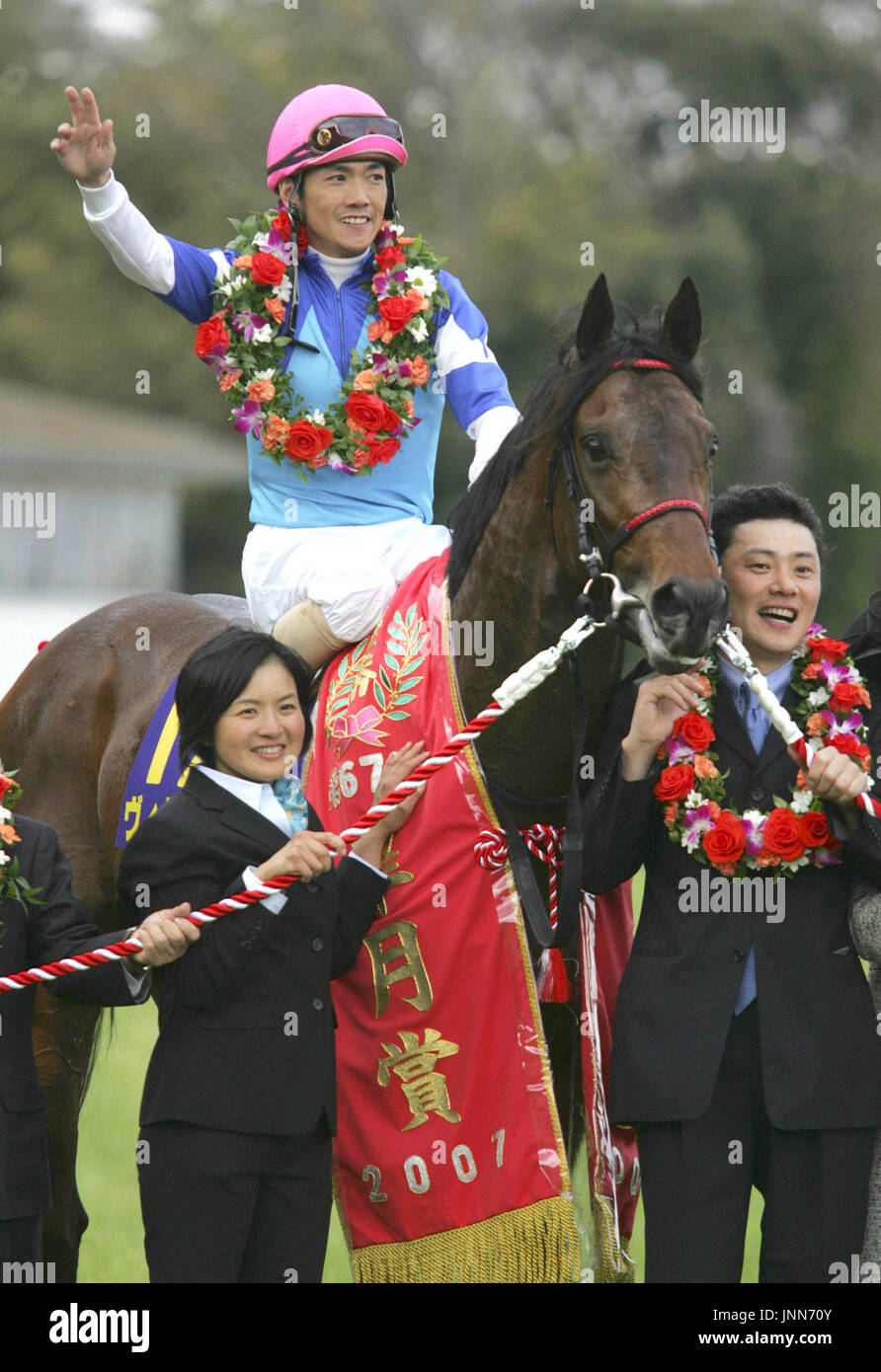 FUNABASHI, Japan - Jockey Katsuharu Tanaka mounted on Victory ...
