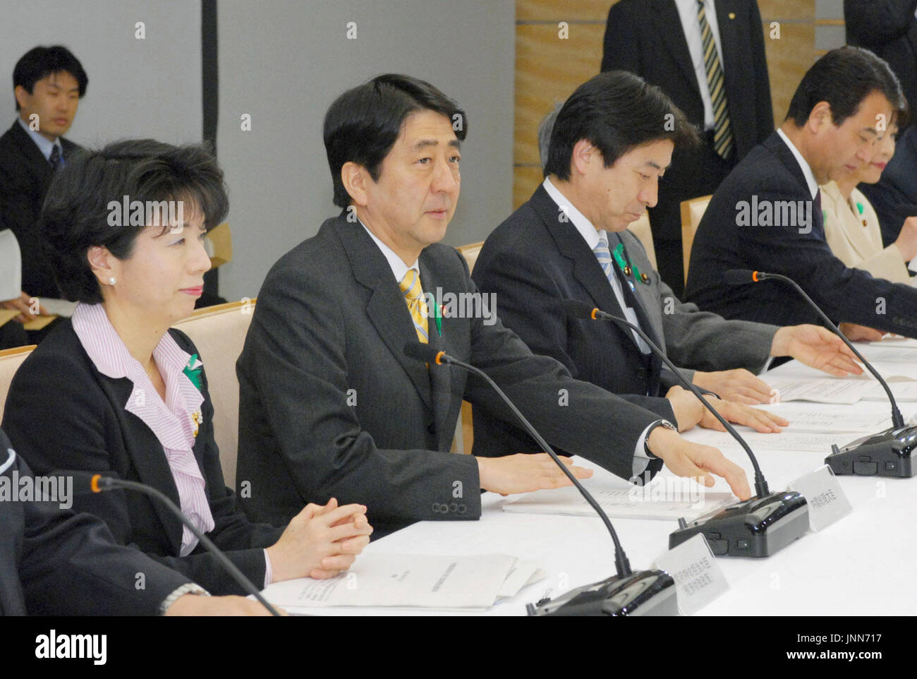 TOKYO, Japan - Prime Minister Shinzo Abe (2nd from L), flanked by ...