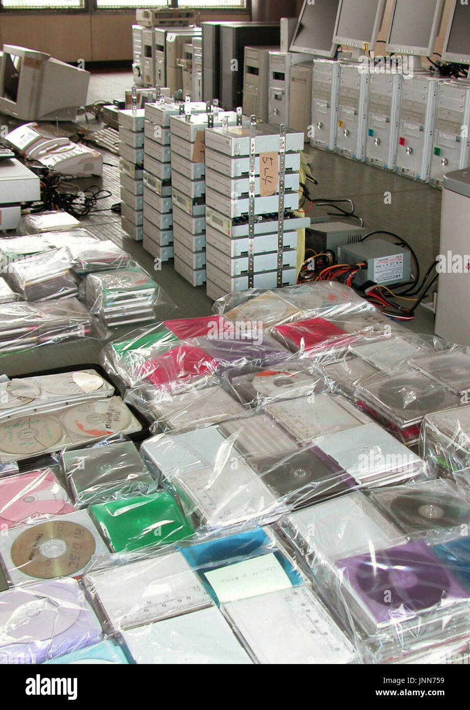 NAGOYA, Japan - Pirated DVDs and computer equipment on display at the ...