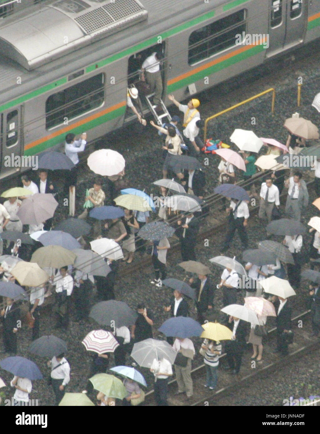 TOKYO, Japan - Passengers get off a train on JR Tohoku Line to walk ...