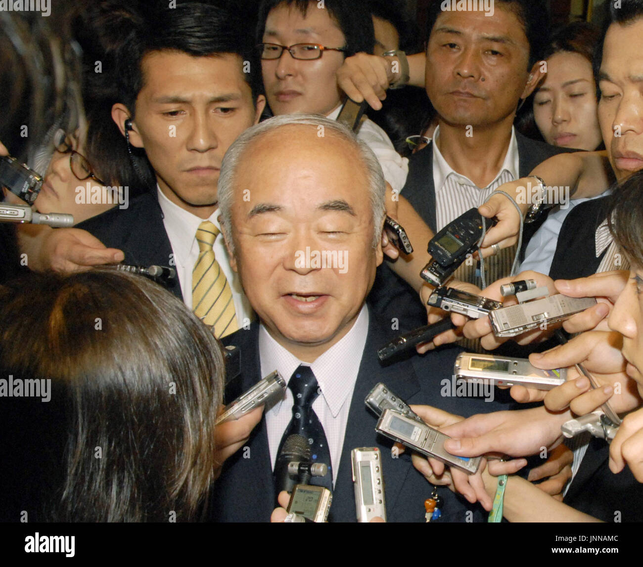 TOKYO, Japan - Defense Minister Fumio Kyuma is surrounded by reporters ...