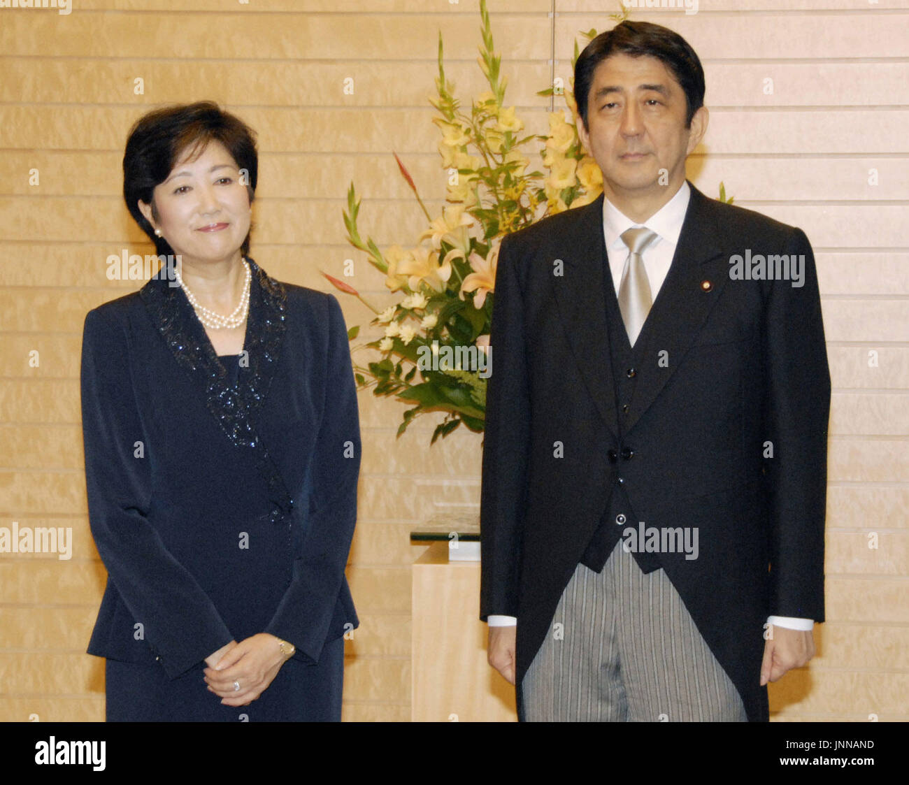 TOKYO, Japan - Newly appointed Defense Minister Yuriko Koike (L) poses ...