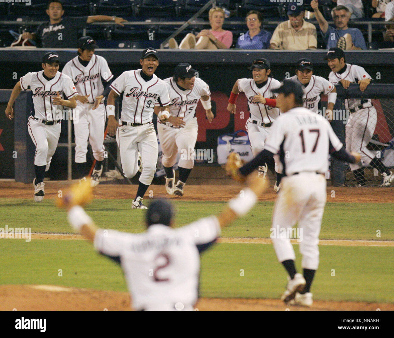 DURHAM, United States - Members of Japan's collegiate baseball team run ...
