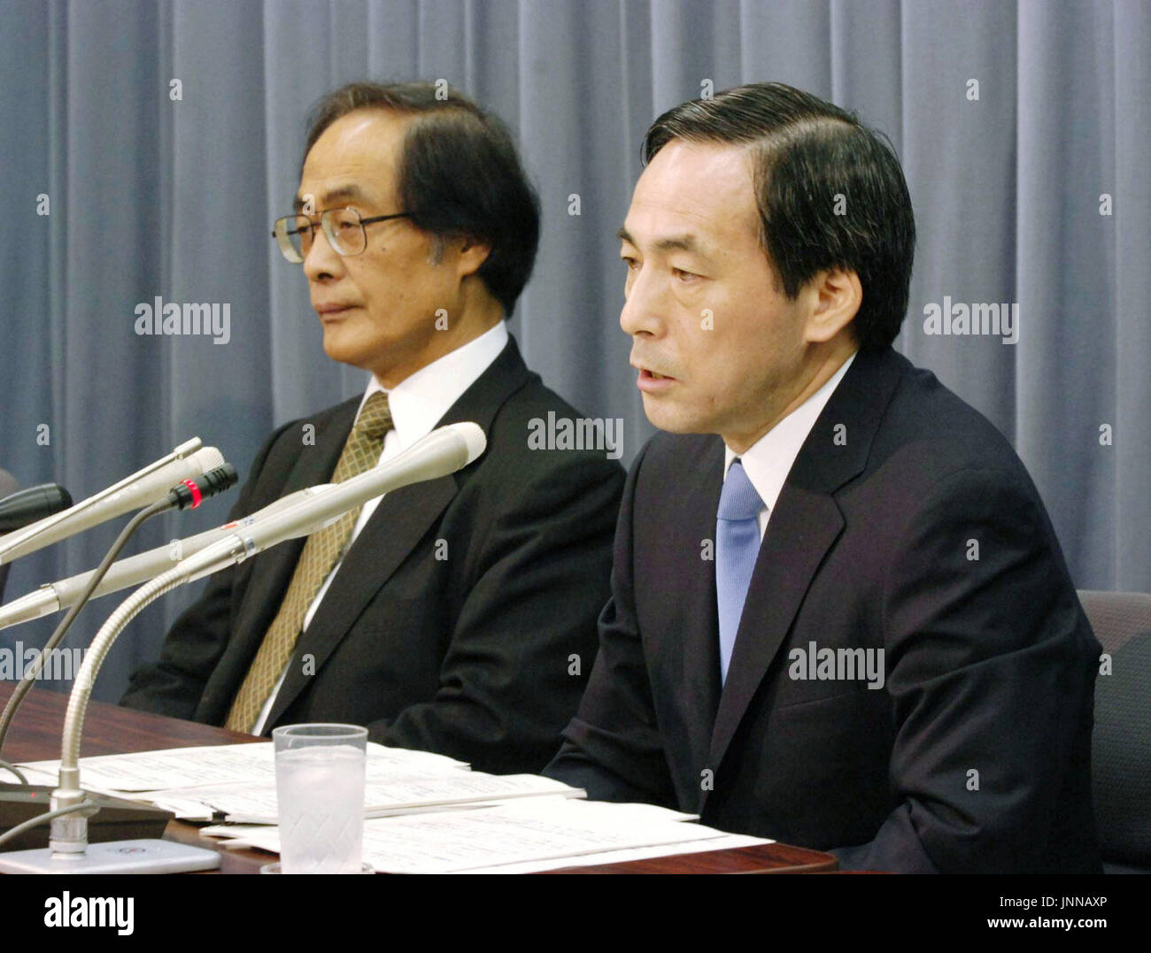 TOKYO, Japan - New Vice Finance Minister Hiroki Tsuda (R) speaks at a press conference at his ...