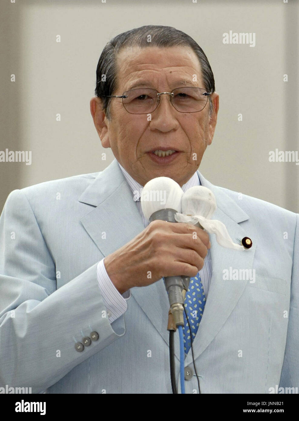TOKYO, Japan - People's New Party leader Tamisuke Watanuki delivers his ...