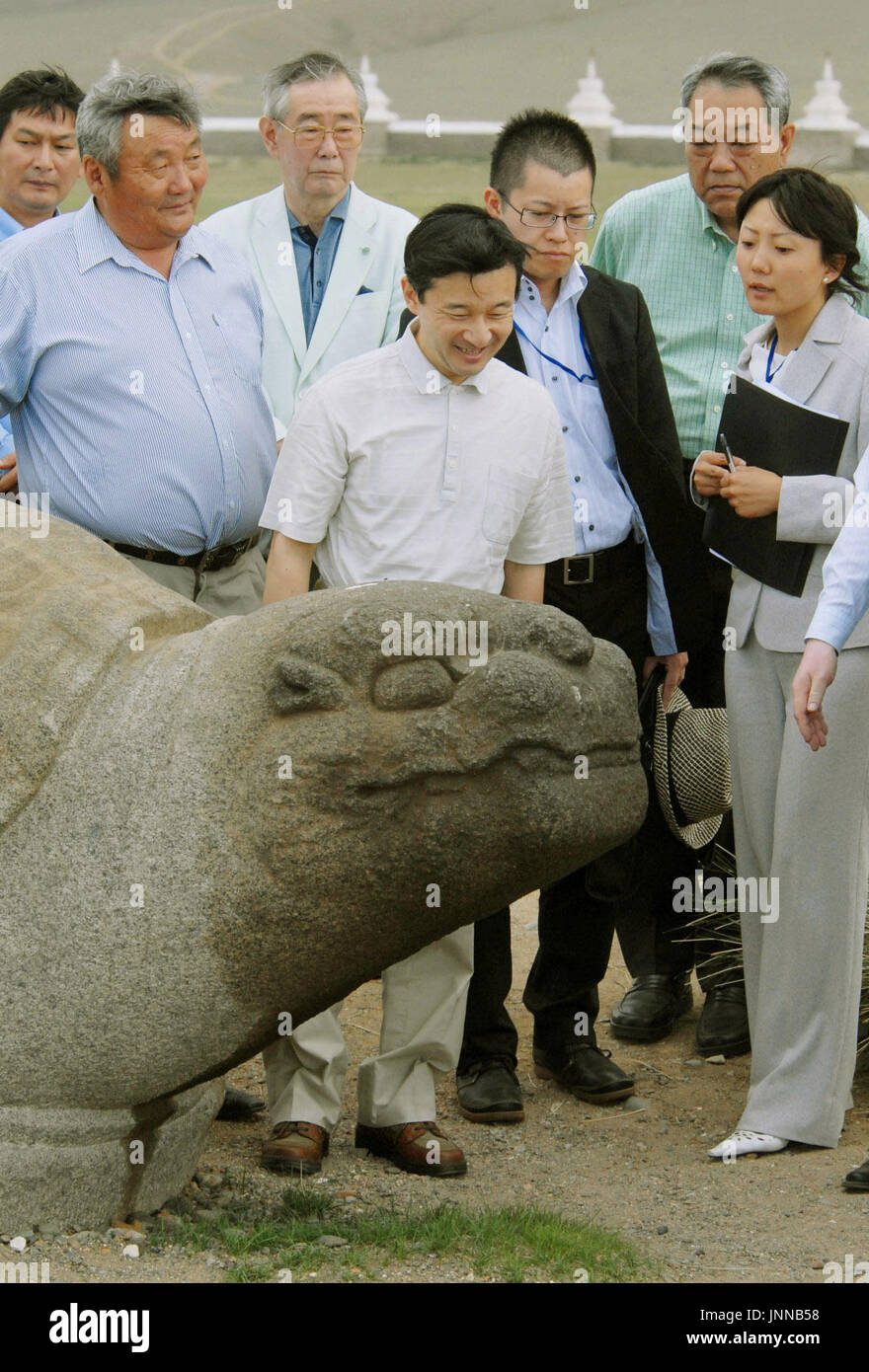 HARHORIN, Mongolia - Japanese Crown Prince Naruhito (C) inspects an old ...