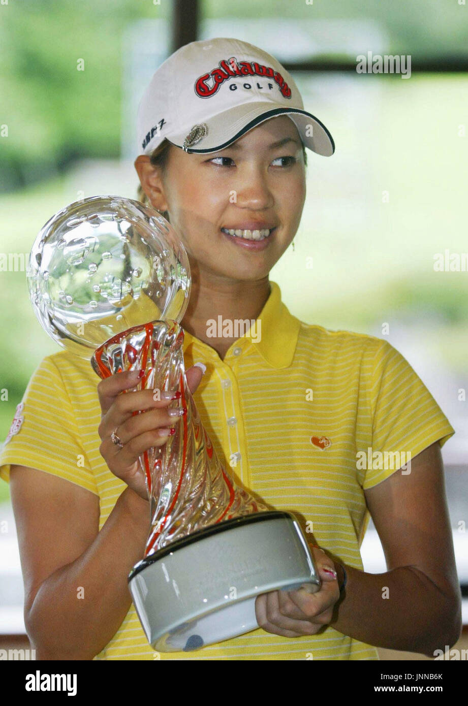 SUSONO, Japan - Momoko Ueda holds up her trophy after winning the ...