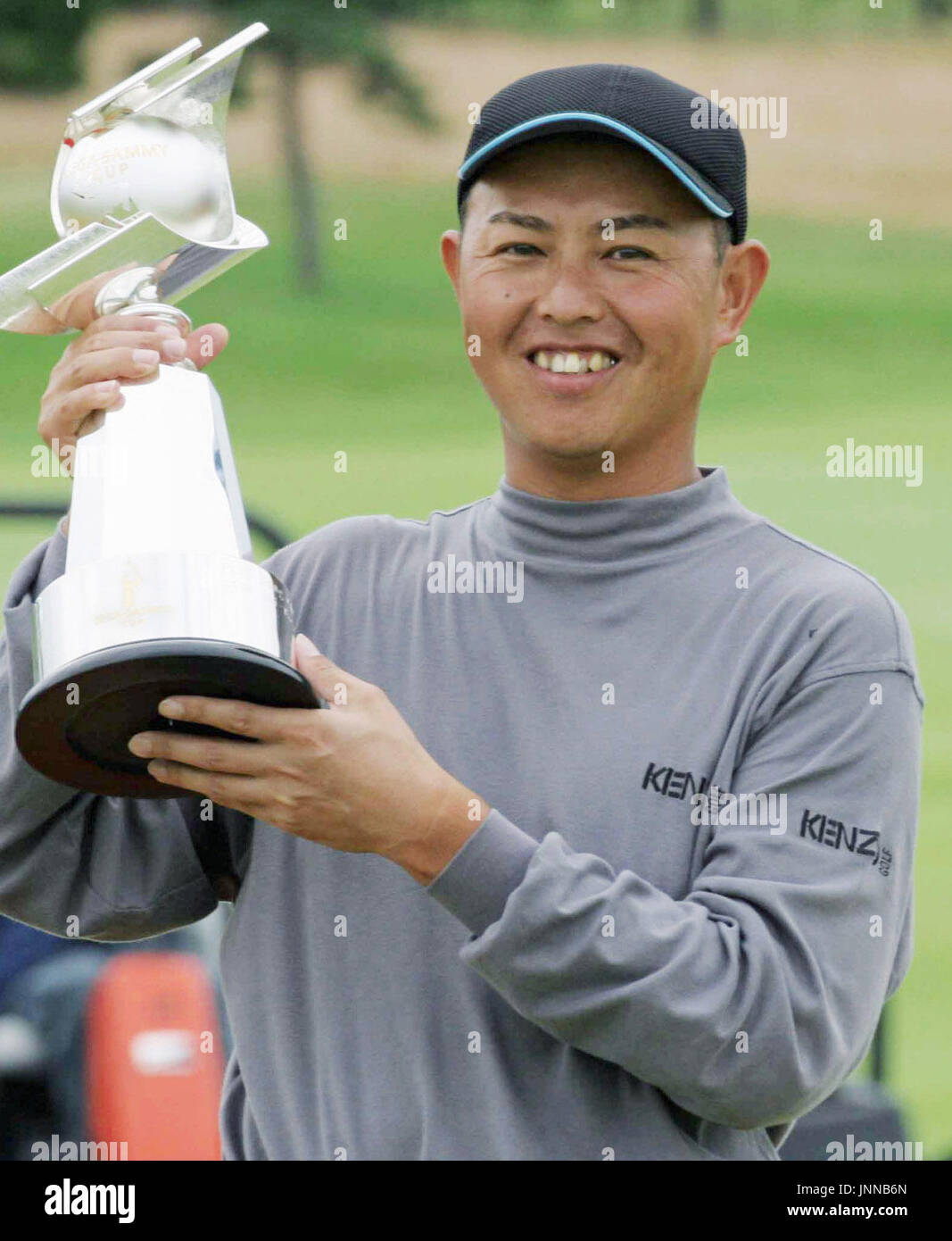 CHITOSE, Japan - Toru Taniguchi holds up his trophy after winning the ...