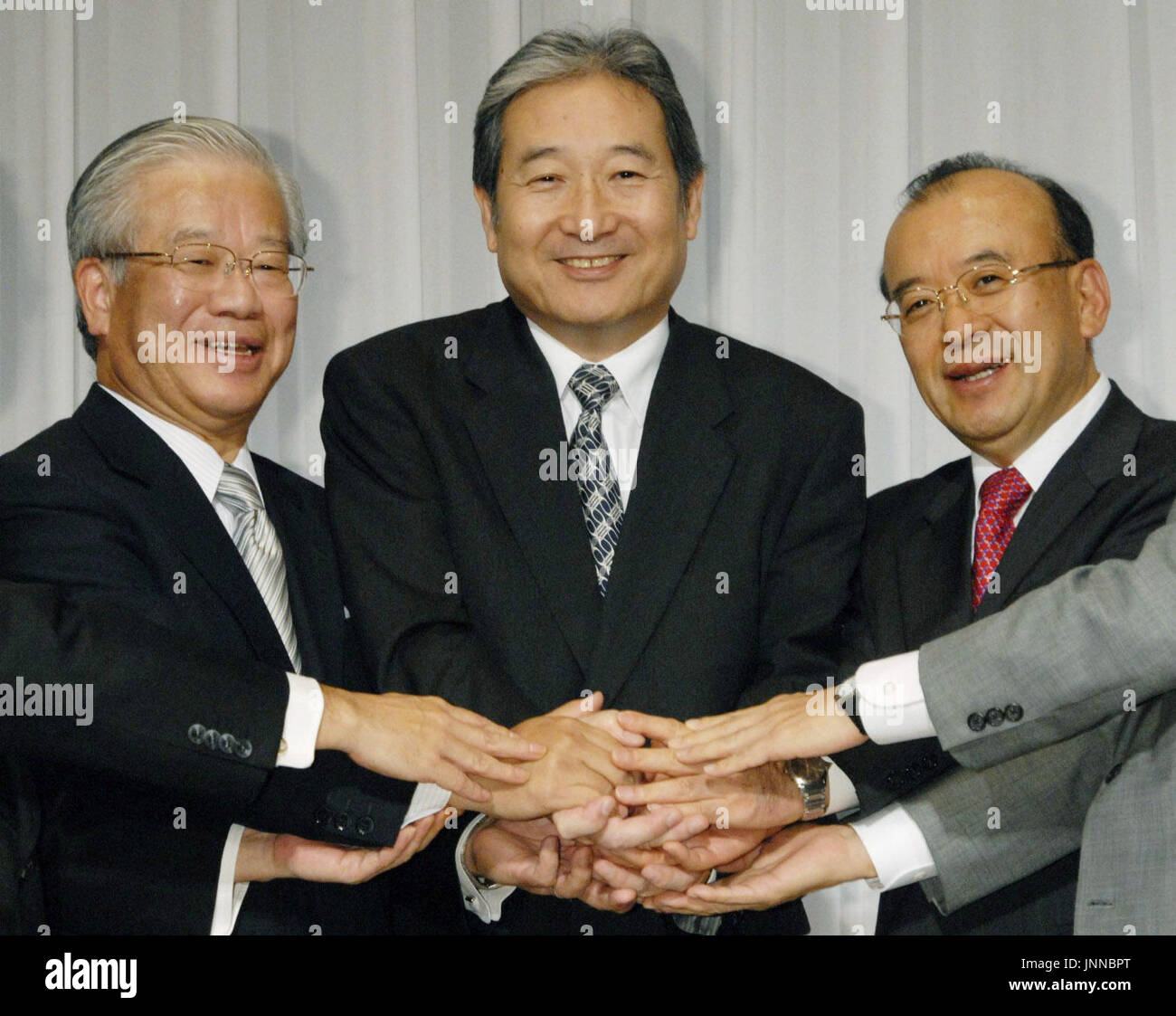 TOKYO, Japan - Masayuki Nishi (L), chairman of Sumitomo Mitsui ...