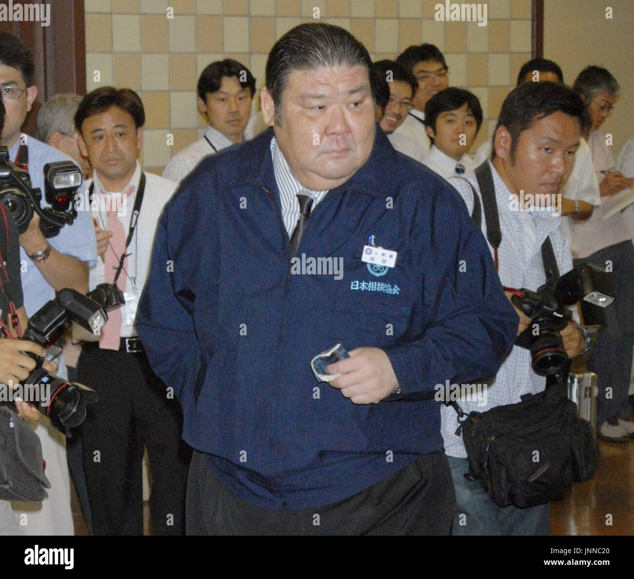TOKYO, Japan - Takasago Stable master Takasago looks nervous as he ...