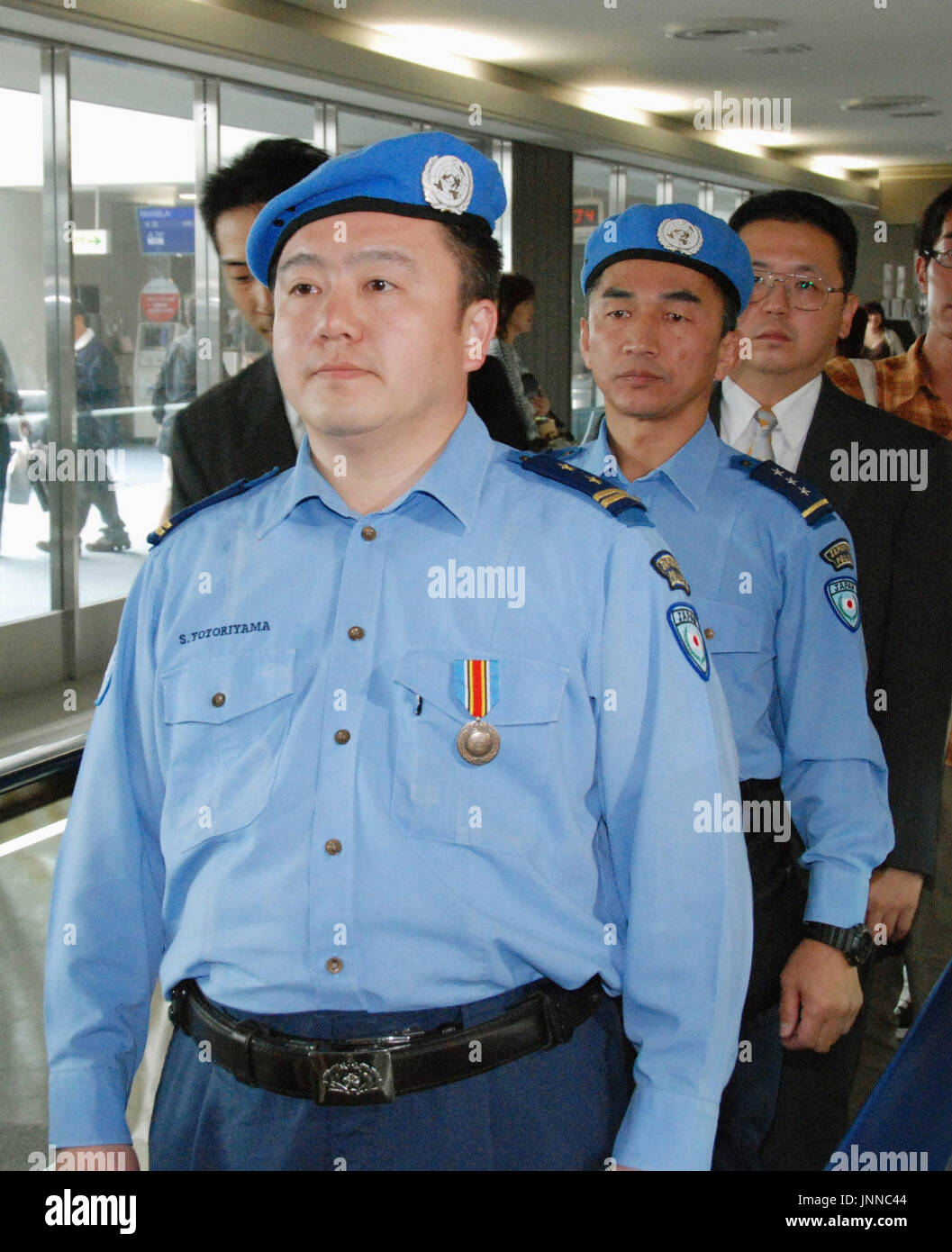 NARITA, Japan - Two Japanese police officers and a liaison officer ...