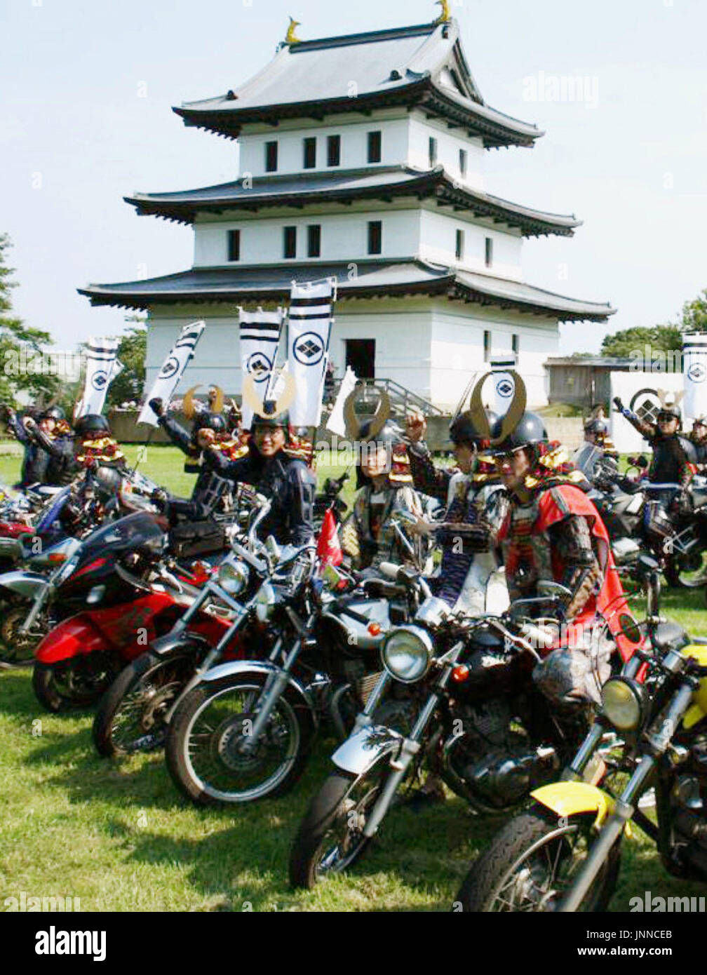 SAPPORO, Japan - Bikers dressed in ancient warrior attire pose in front ...