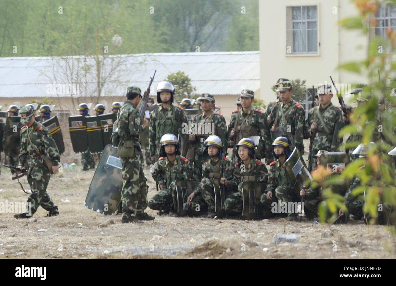 SHANGRI-LA, China - About 1,000 riot police were seen marching in an ...
