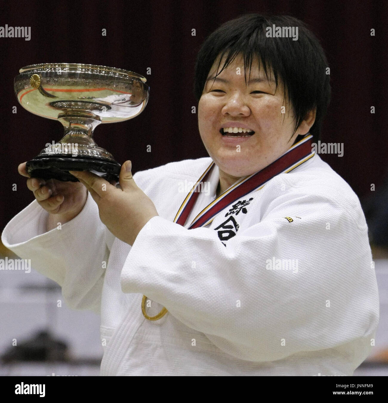 TOKYO, Japan - Athens Olympic champion Maki Tsukada poses with the winner's trophy after ...