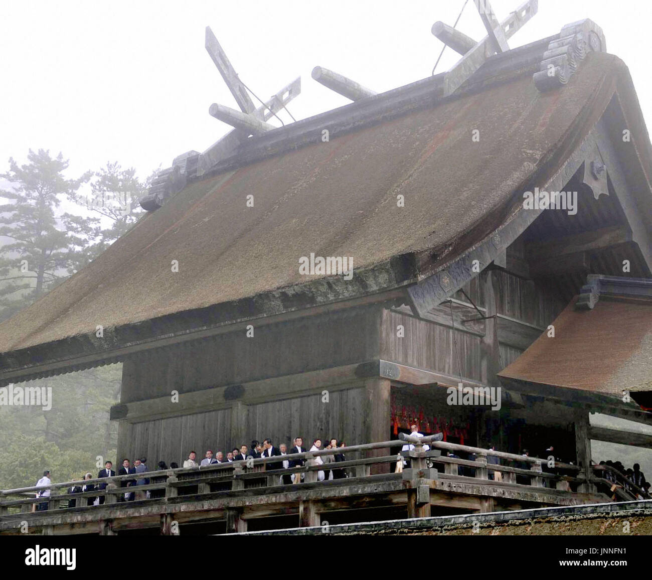 IZUMO, Japan - Visitors walk on the veranda of the main hall of Izumo ...
