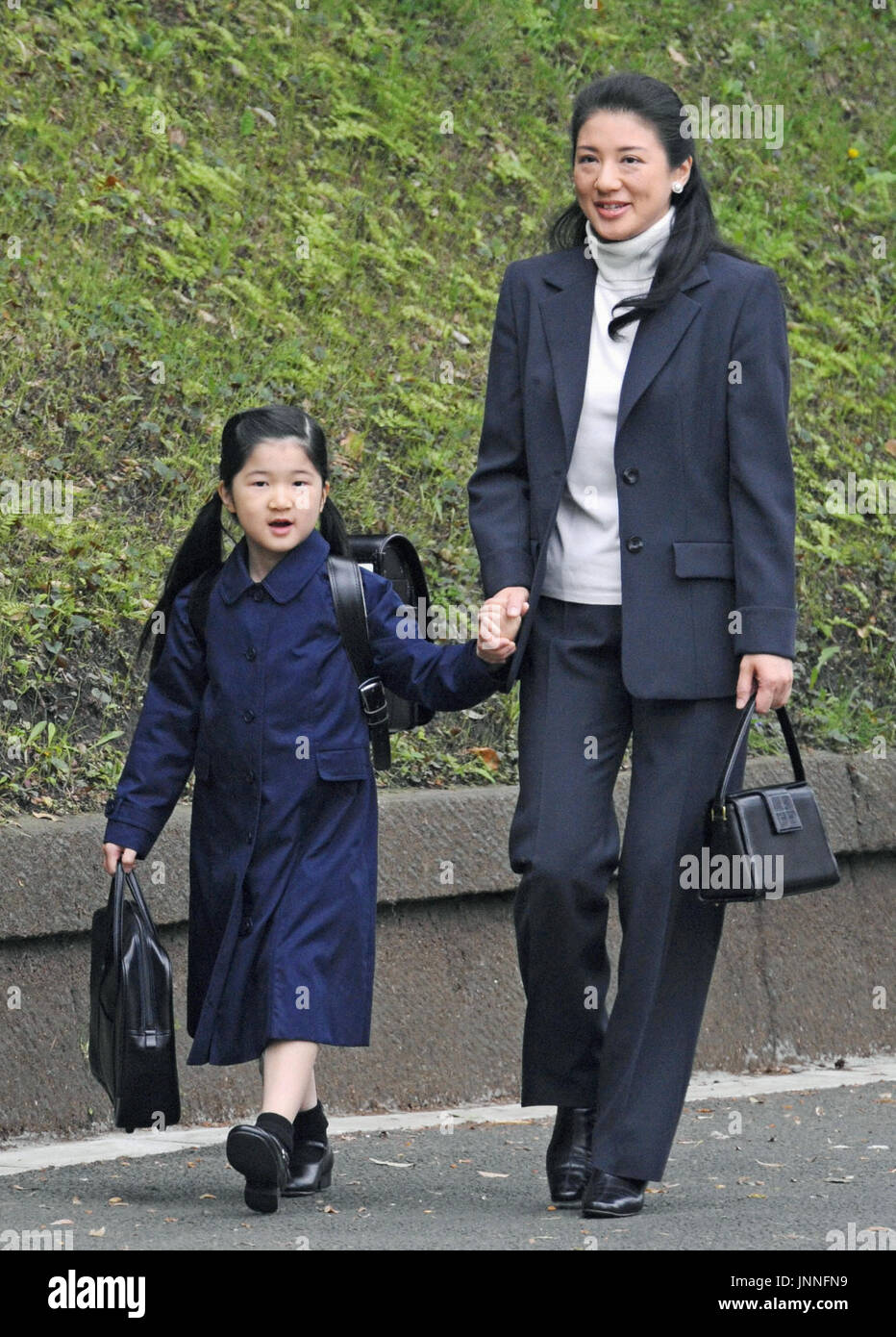TOKYO, Japan - Crown Princess Masako walks her daughter Princess Aiko ...