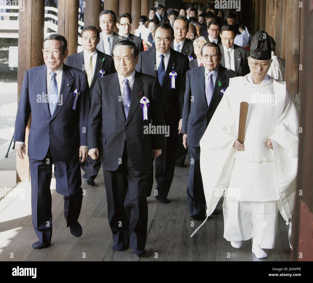 TOKYO, Japan - A group of Diet members emerge from the sanctum of ...