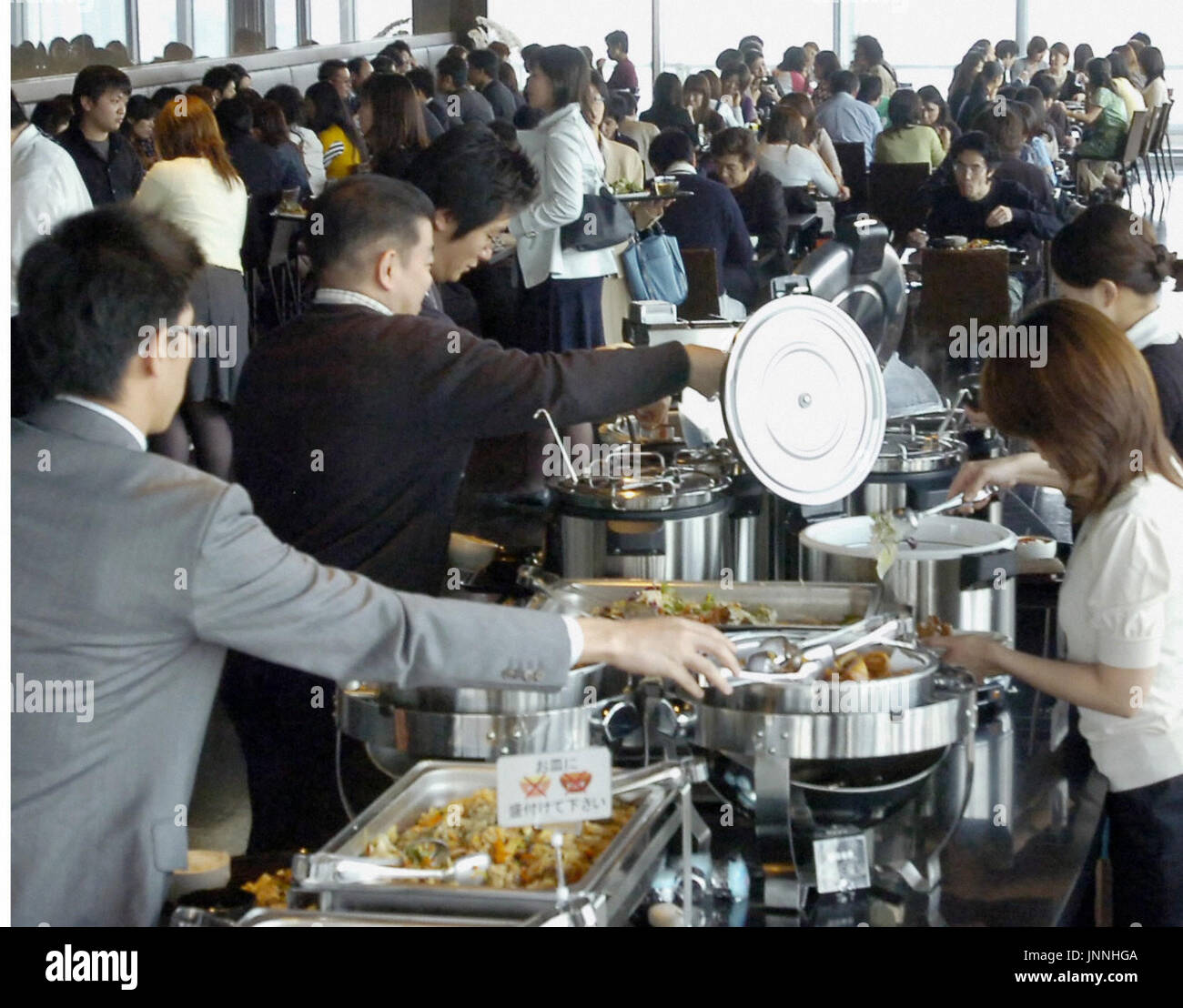 TOKYO, Japan - Employees of Recruit Co. in Tokyo's Chiyoda Ward gather ...