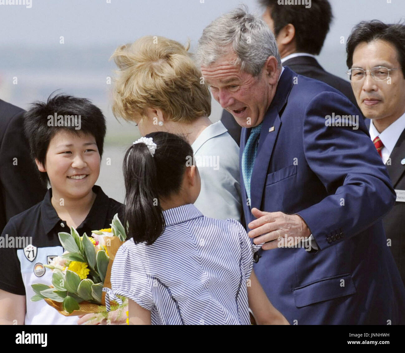 CHITOSE, Japan - U.S. President George W. Bush (R in front) and his ...