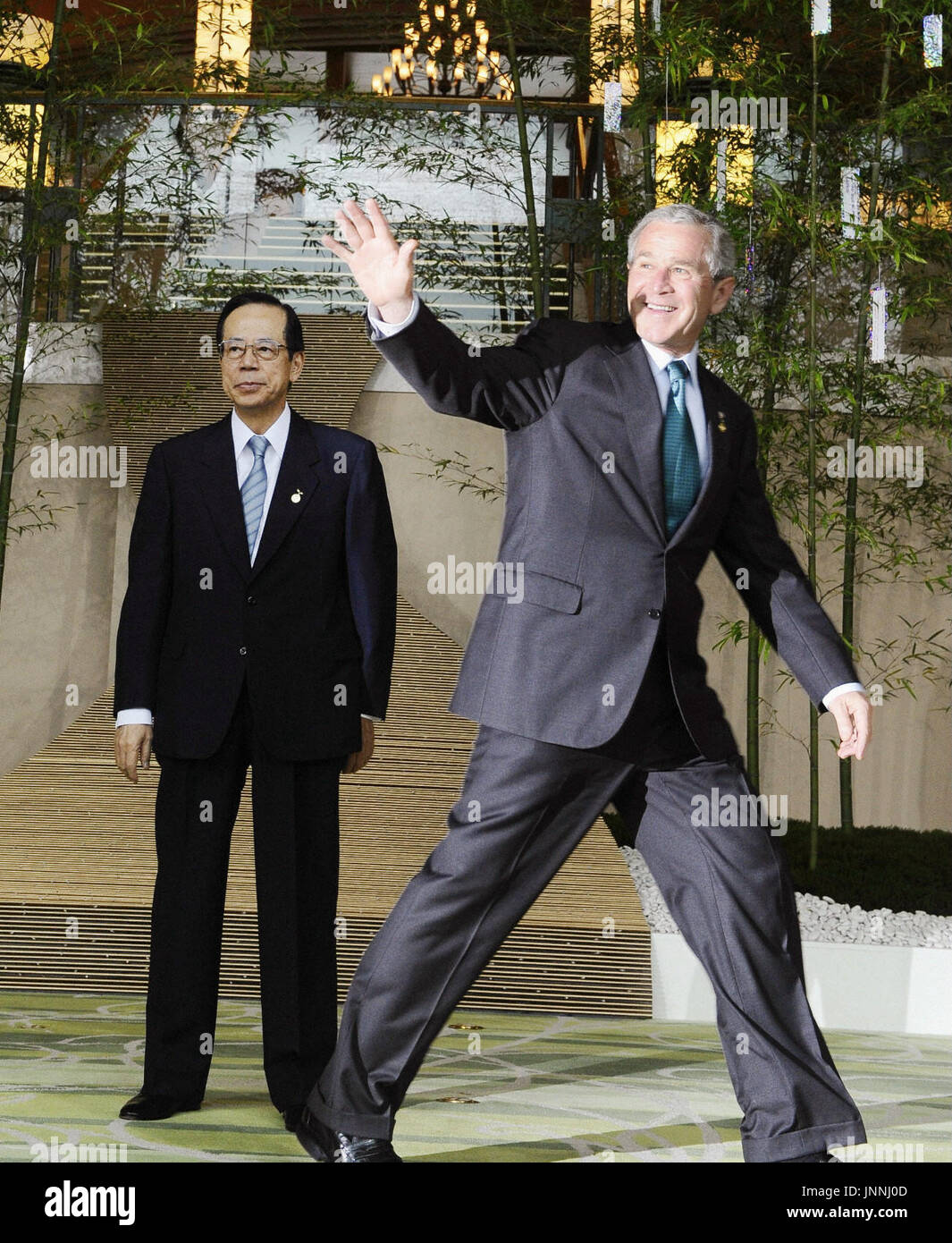 TOYAKO, Japan - U.S. President George W. Bush waves to photographers as ...