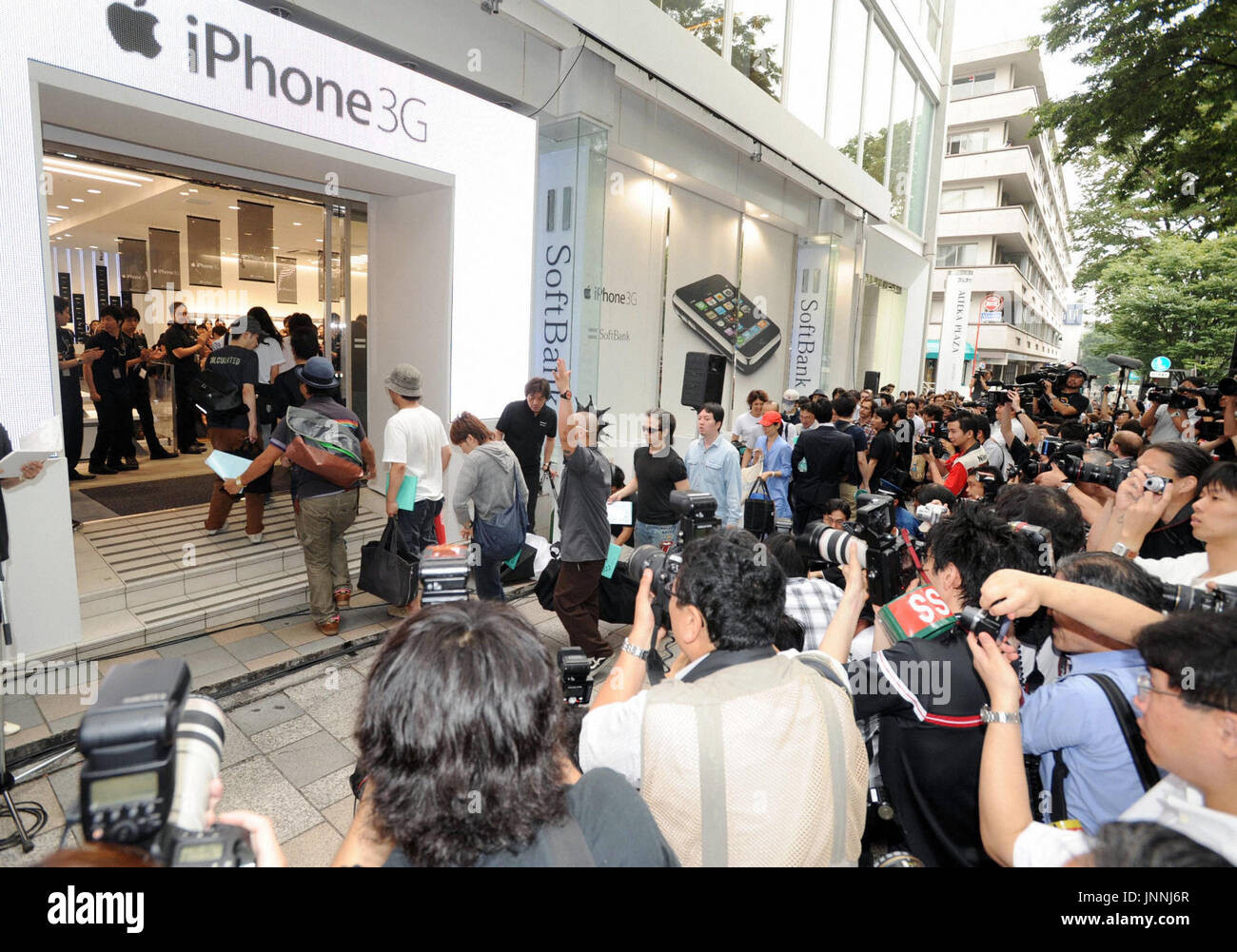 TOKYO, Japan - People enter Softbank Mobile Corp.'s flagship store in ...