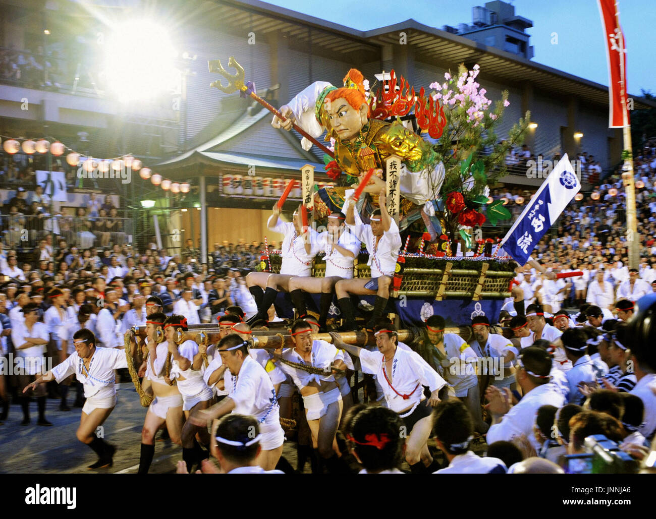 FUKUOKA, Japan - A decorated float called Yamagasa is carried by young ...