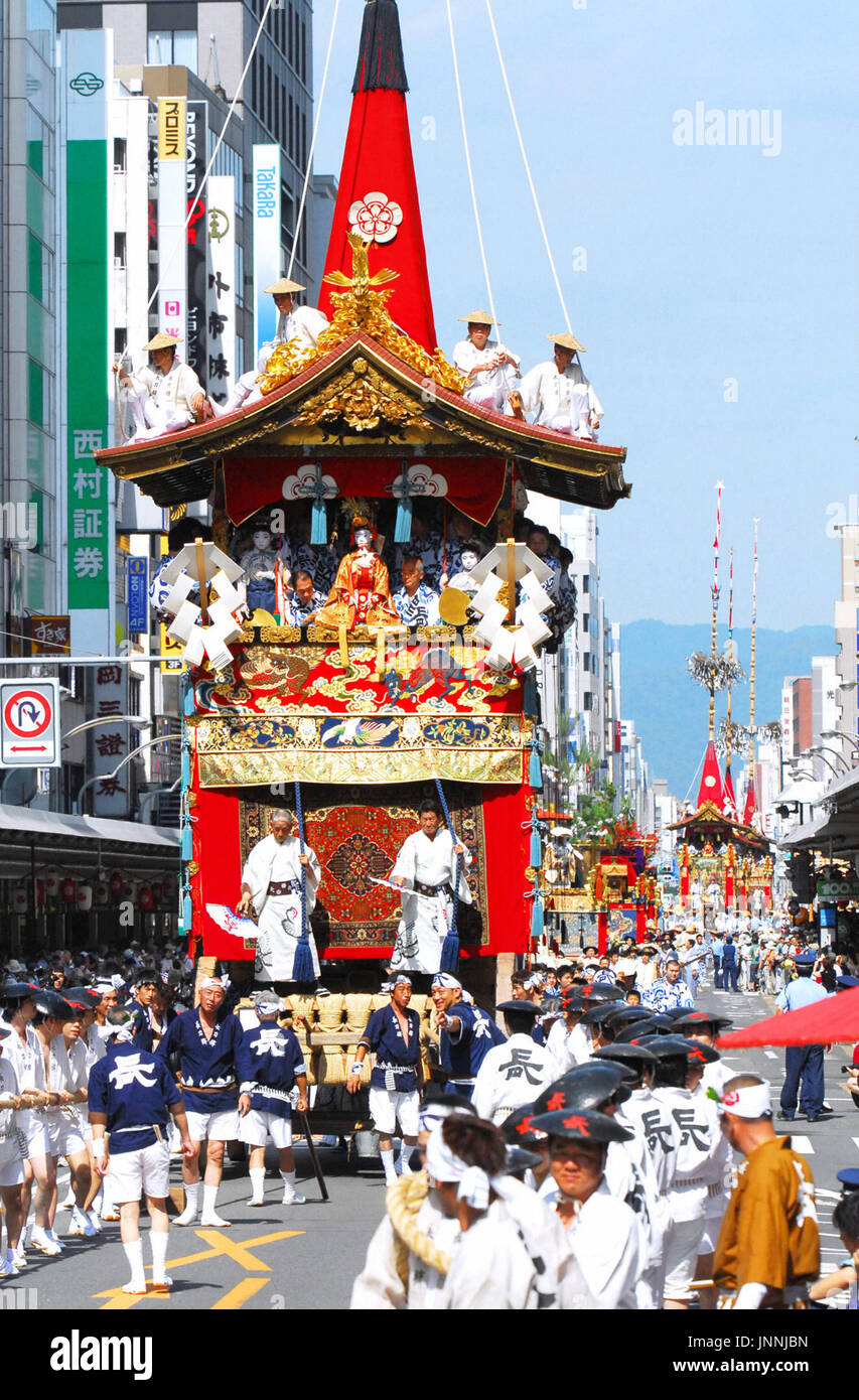 KYOTO, Japan - A decorated float parades through a street in Japan's ...