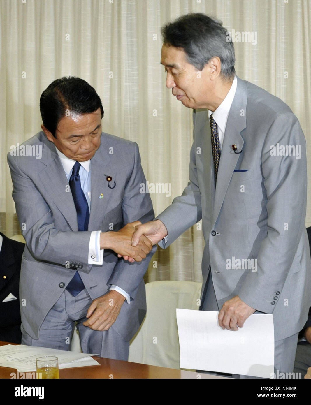 TOKYO, Japan - Taro Aso (L), new secretary general of the ruling ...
