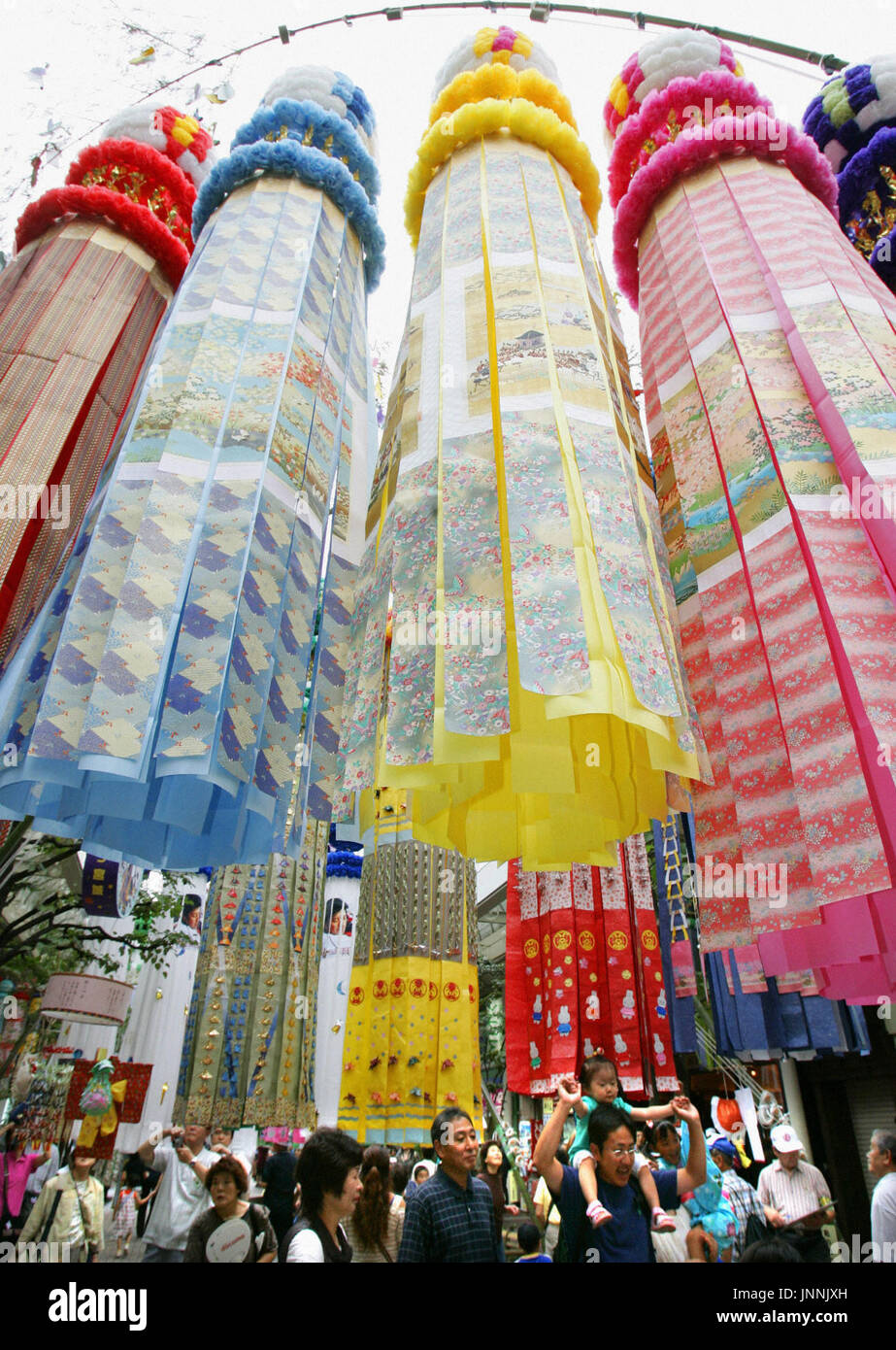 SENDAI, Japan - People walk through a local shopping mall decorated by ...
