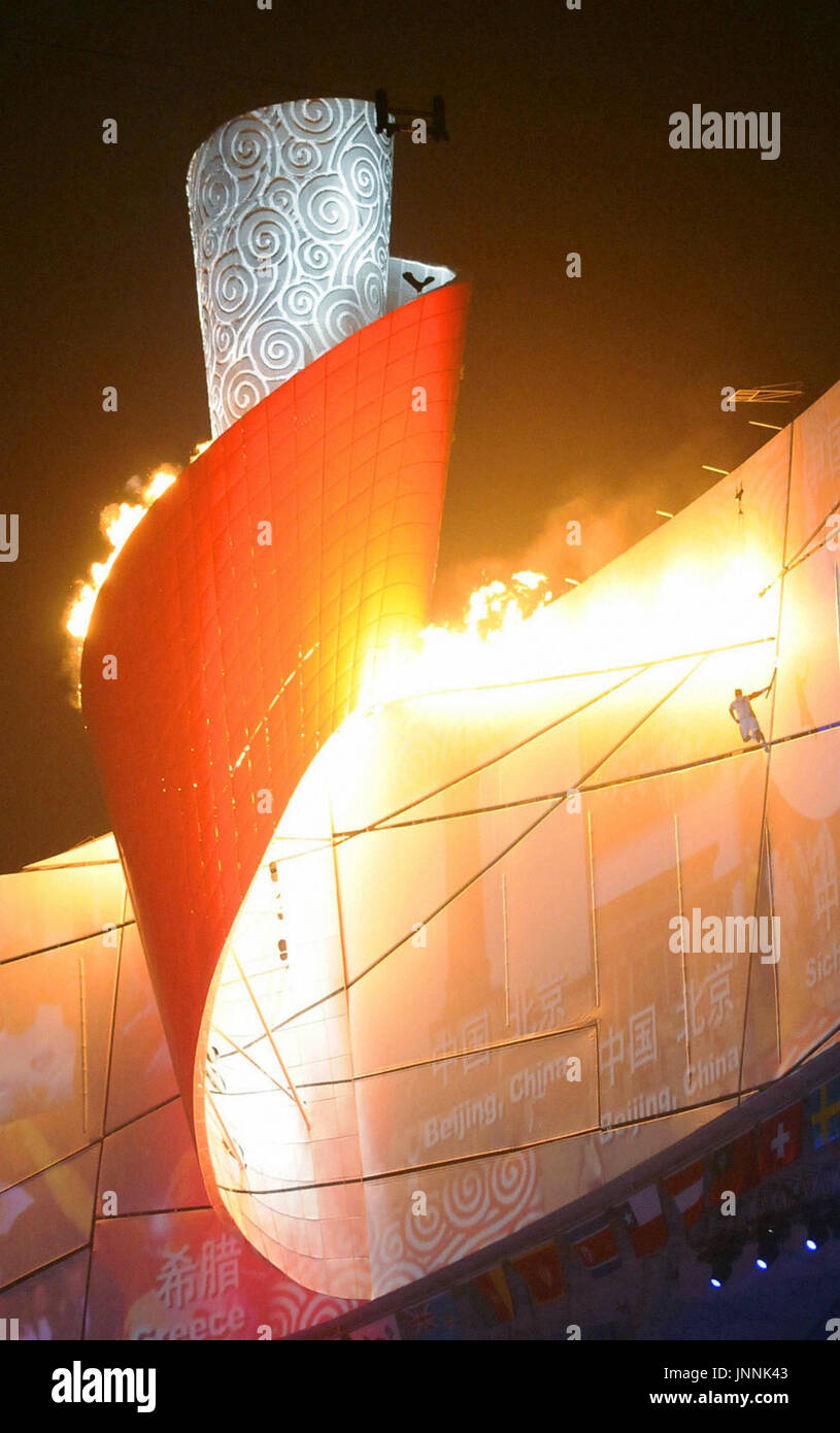 BEIJING, China - The Olympic flame carried by former Olympian Li Ning ...