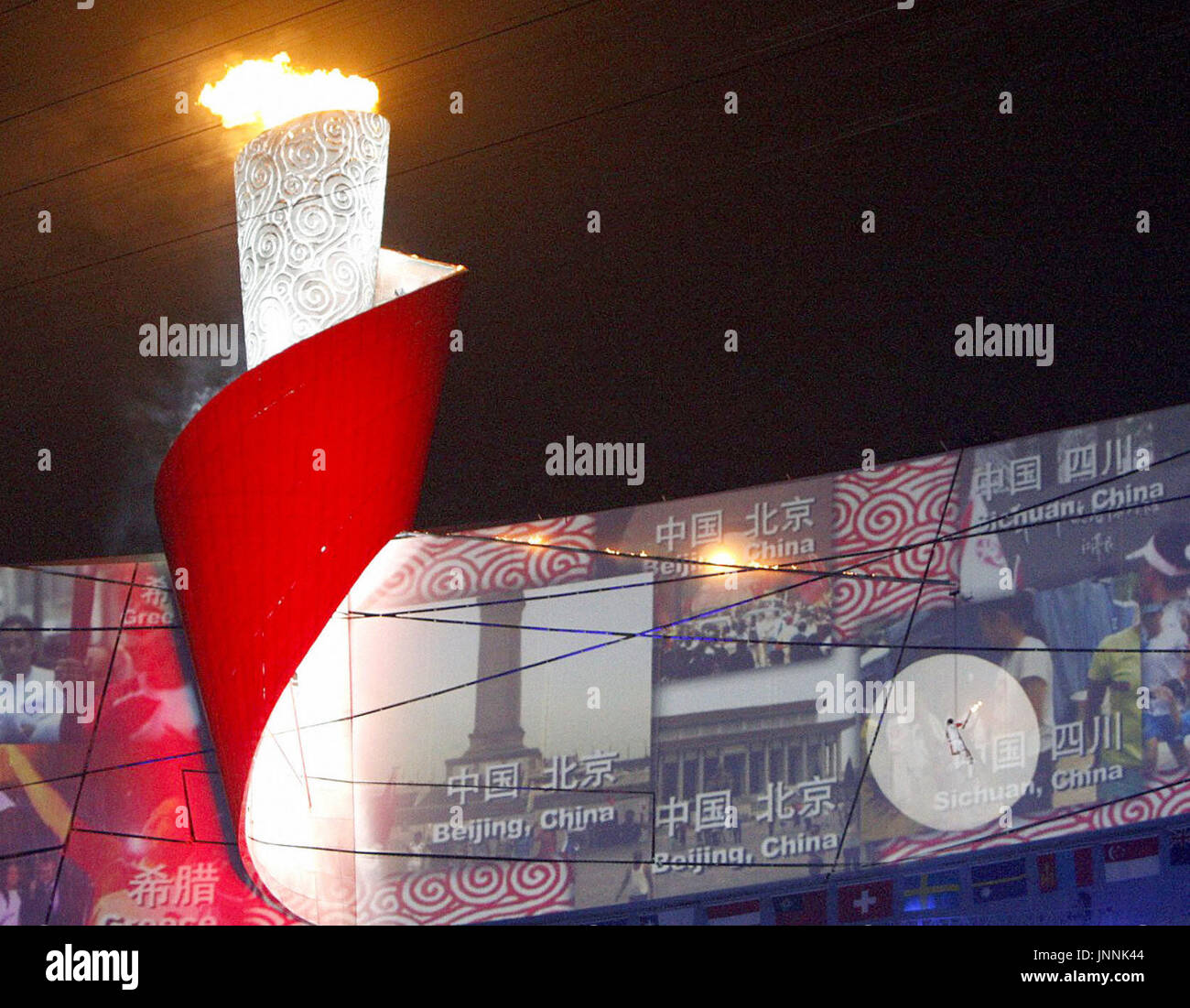 BEIJING, China - The Olympic cauldron is lit by former Olympian Li Ning ...