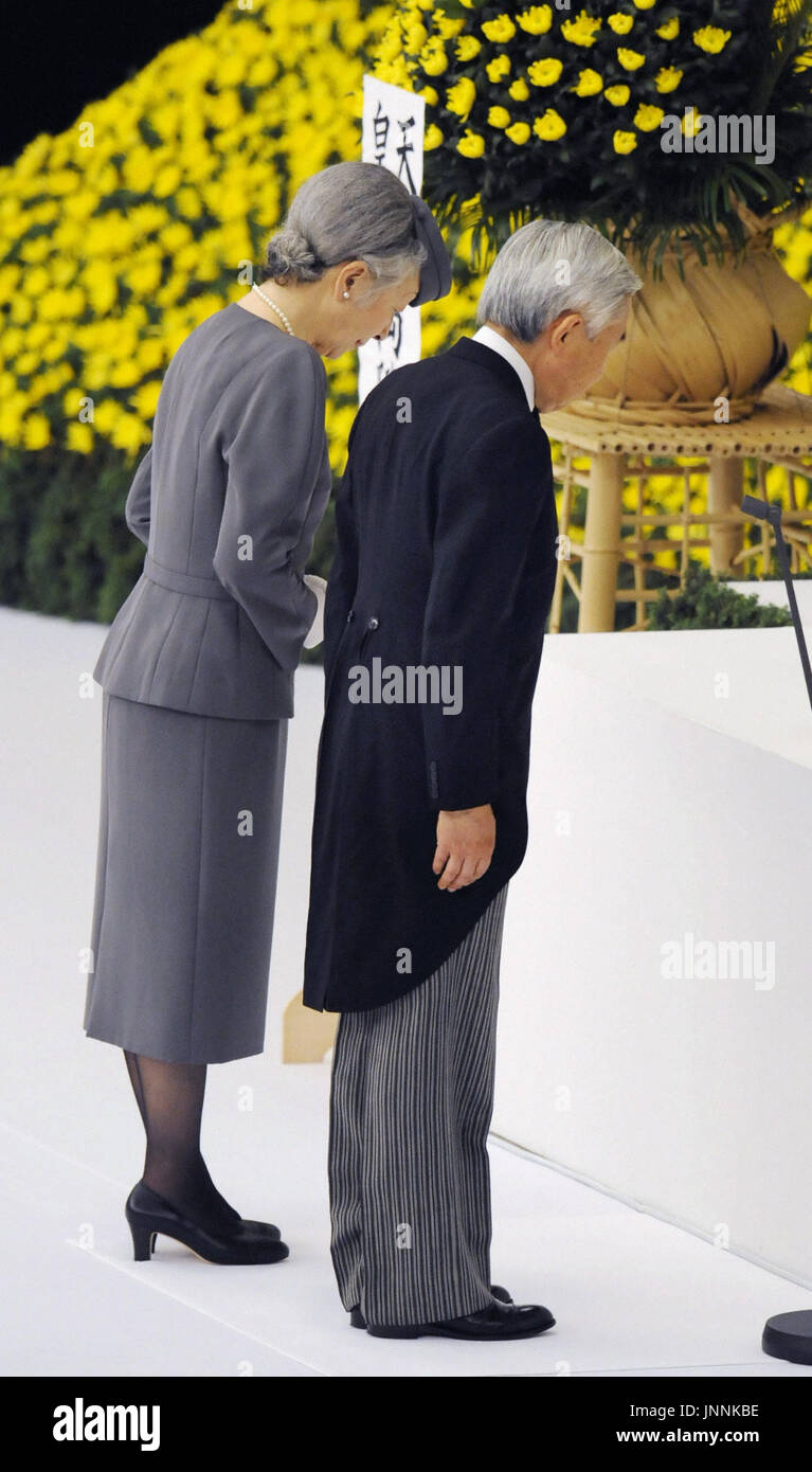 TOKYO, Japan - Emperor Akihito and Empress Michiko offer a silent ...