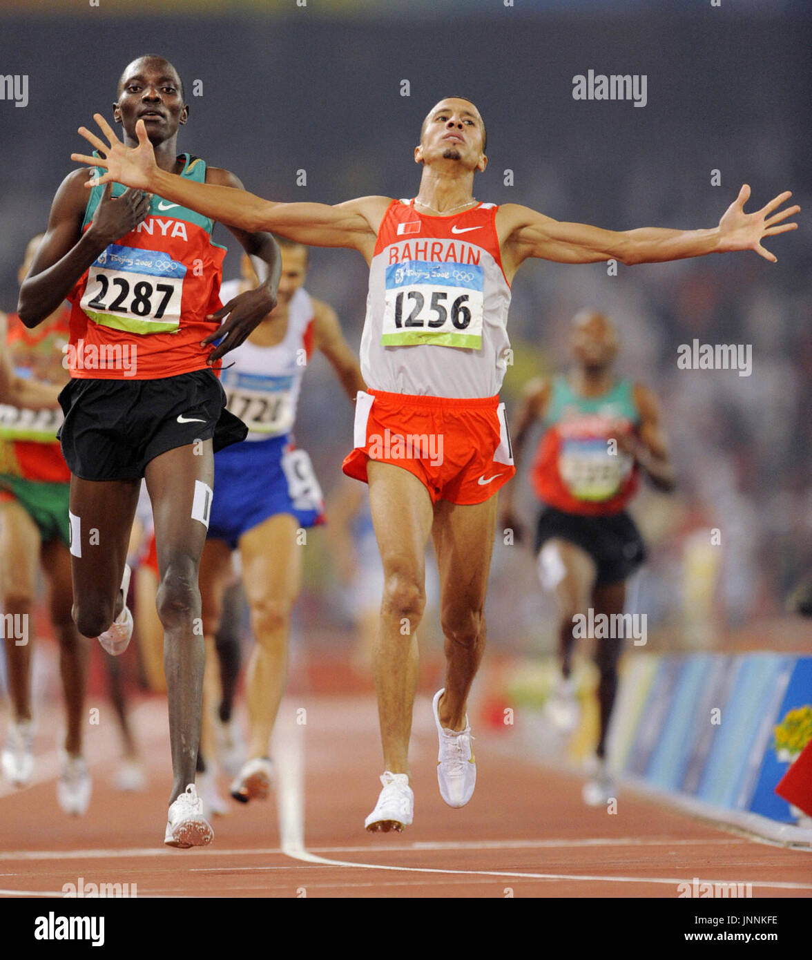 BEIJING, China - Rashid Ramzi (R) of Bahrain wins the men's 1,500-meter ...