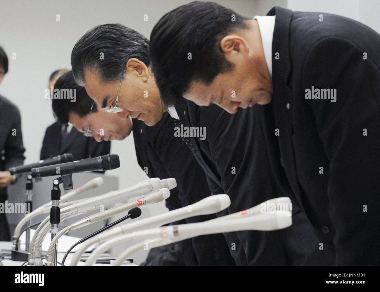 TOKYO, Japan - Makoto Nishimaru (2nd from R), president of condominium ...