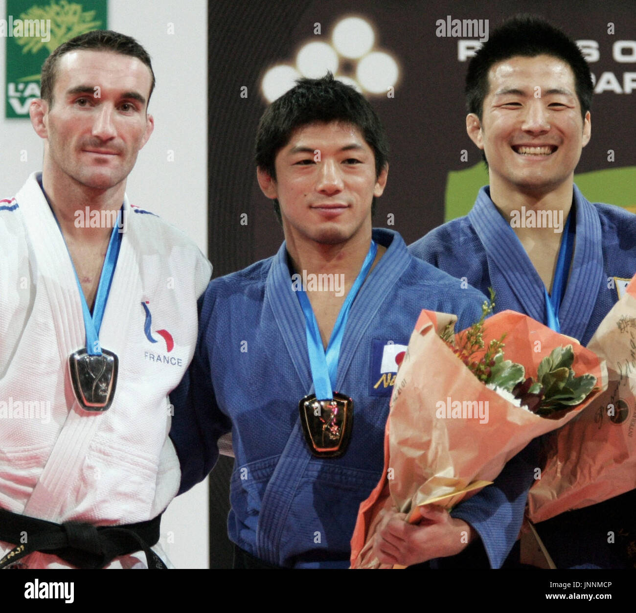 PARIS, France - Japan's Masato Uchishiba (C) poses with his medal on ...