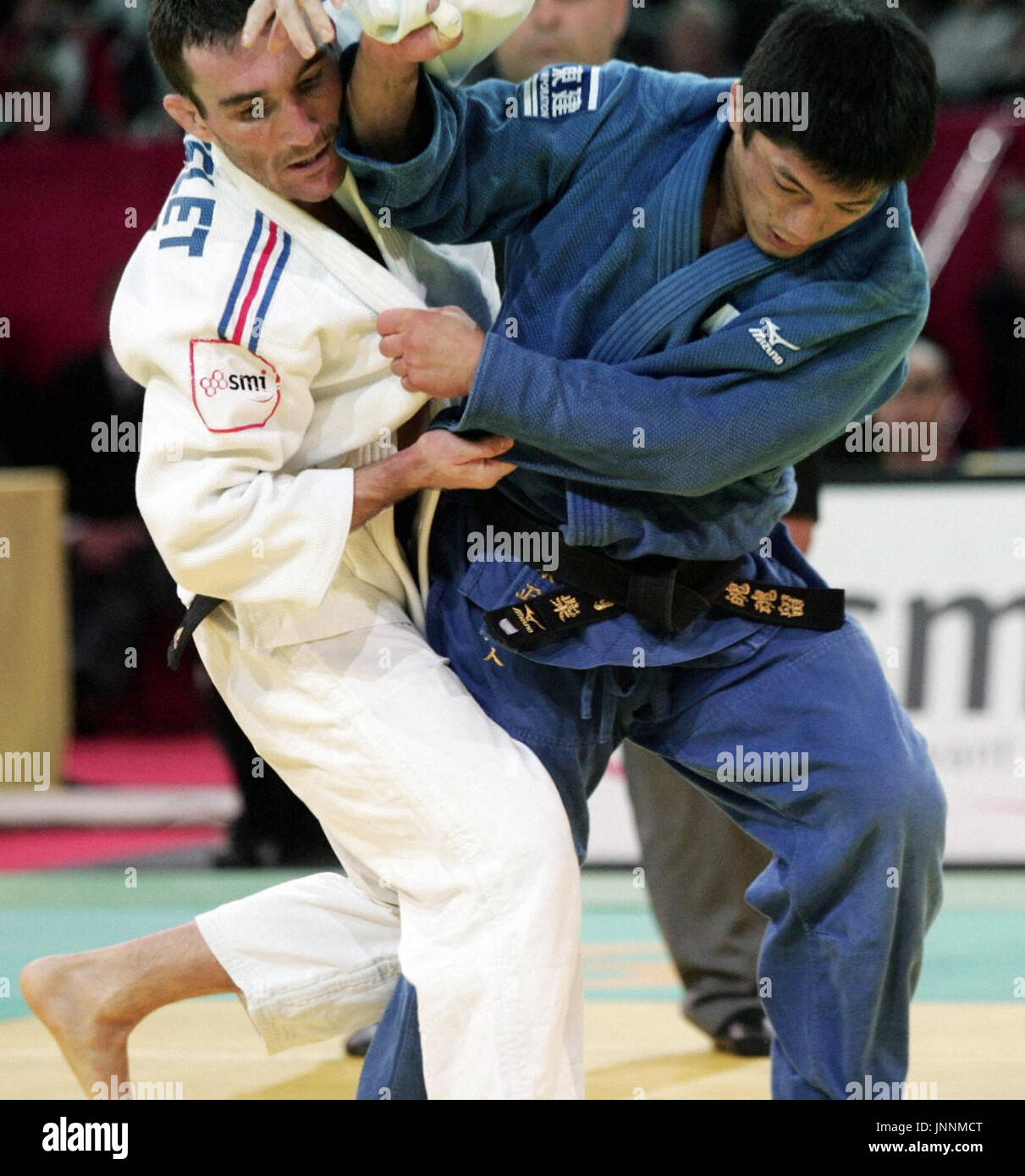 PARIS, France - Japan's Masato Uchishiba (R) challenges France's ...