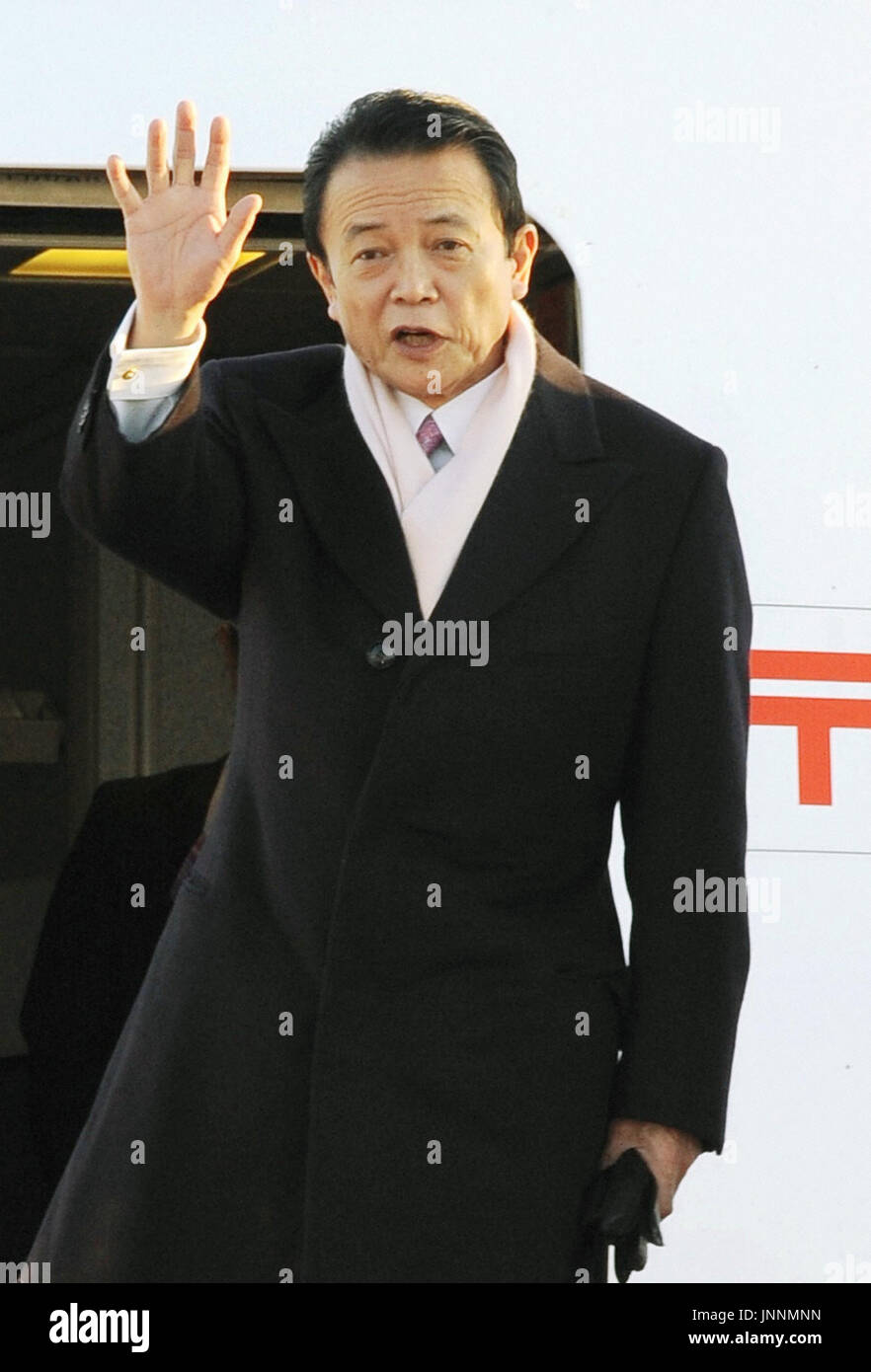 TOKYO, Japan - Japanese Prime Minister Taro Aso waves as he leaves ...