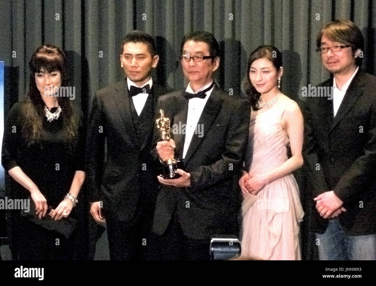 LOS ANGELES, United States - Director Yojiro Takita (C) along with cast ...