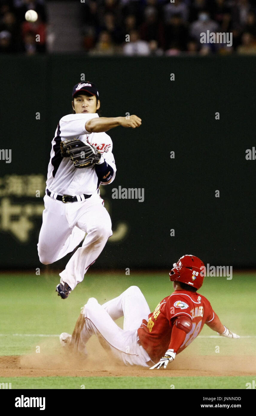 TOKYO, Japan - Japan shortstop Hiroyuki Nakajima throws the ball to ...
