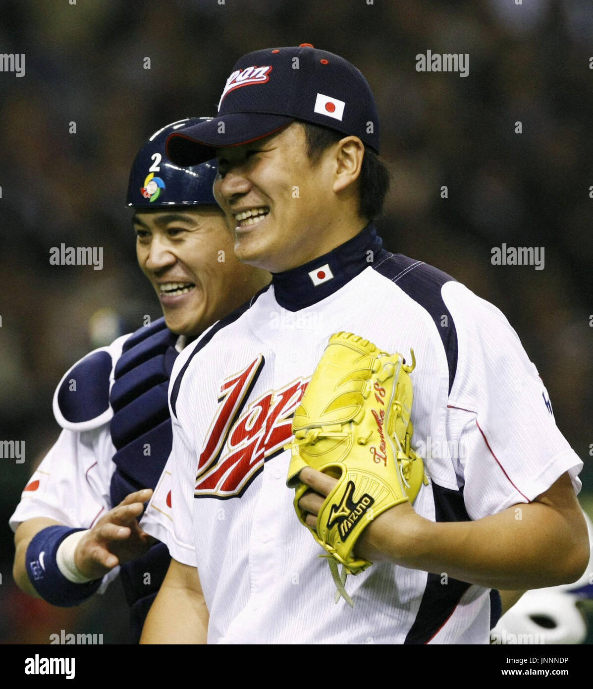 TOKYO, Japan - Japan's set-up man Masahiro Tanaka (R) and catcher Kenji ...