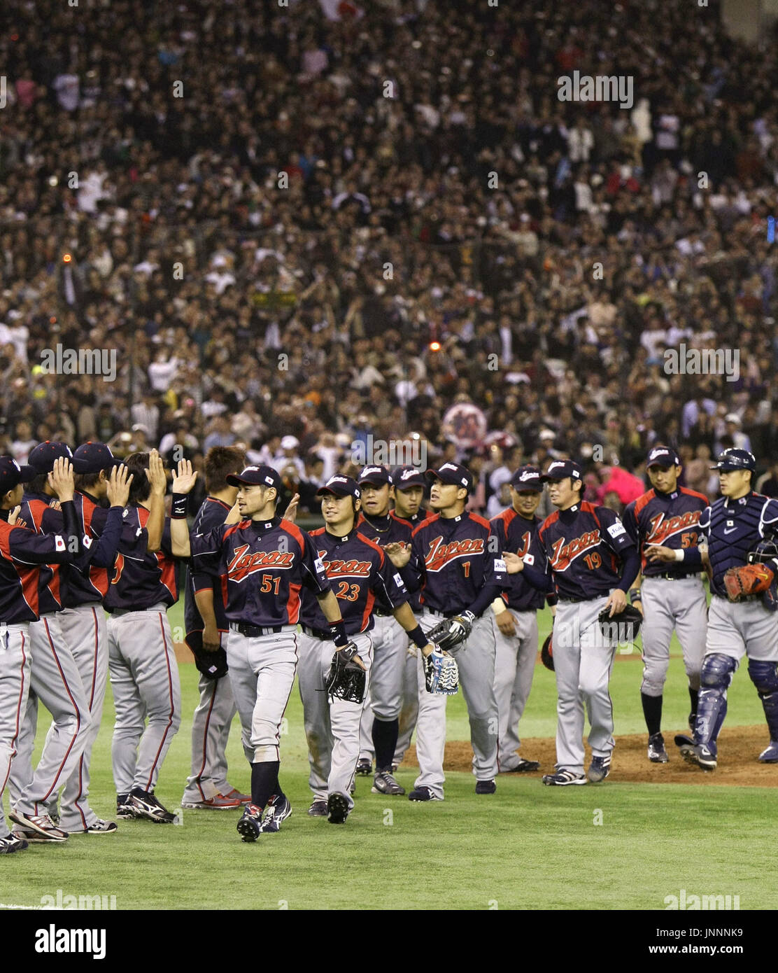 TOKYO, Japan - Japanese baseball players celebrate their 14-2 victory ...