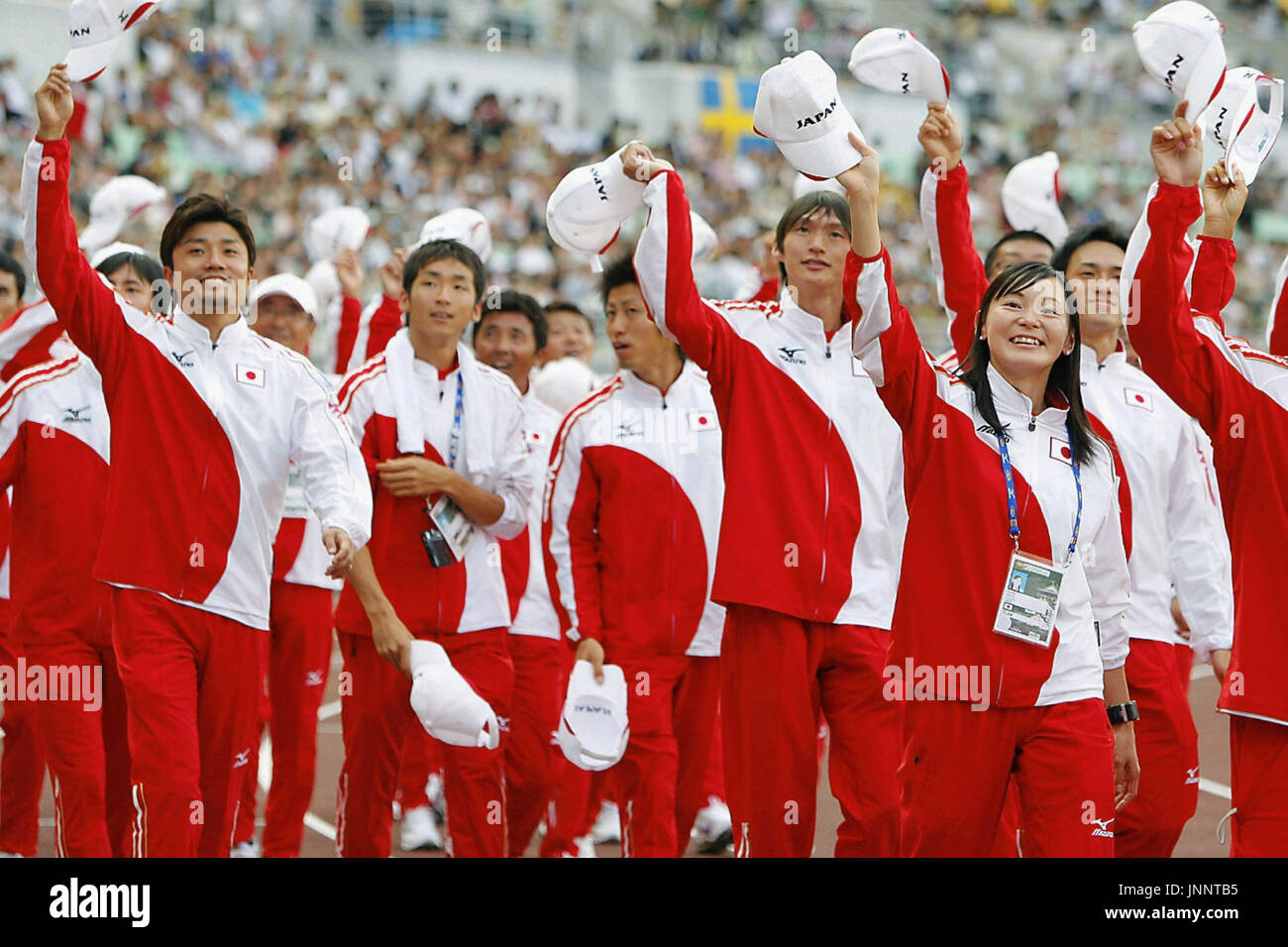 OSAKA, Japan - Japanese athletes wave during the opening ceremony of ...