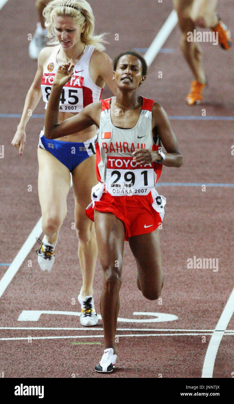 OSAKA, Japan - Bahrain's Maryam Yusuf Jamal (R) crosses the finish line ...