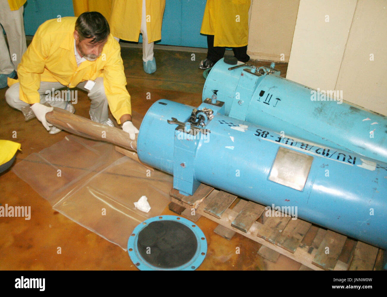 DALAT, Vietnam - A Russian engineer loads a highly enriched uranium rod ...