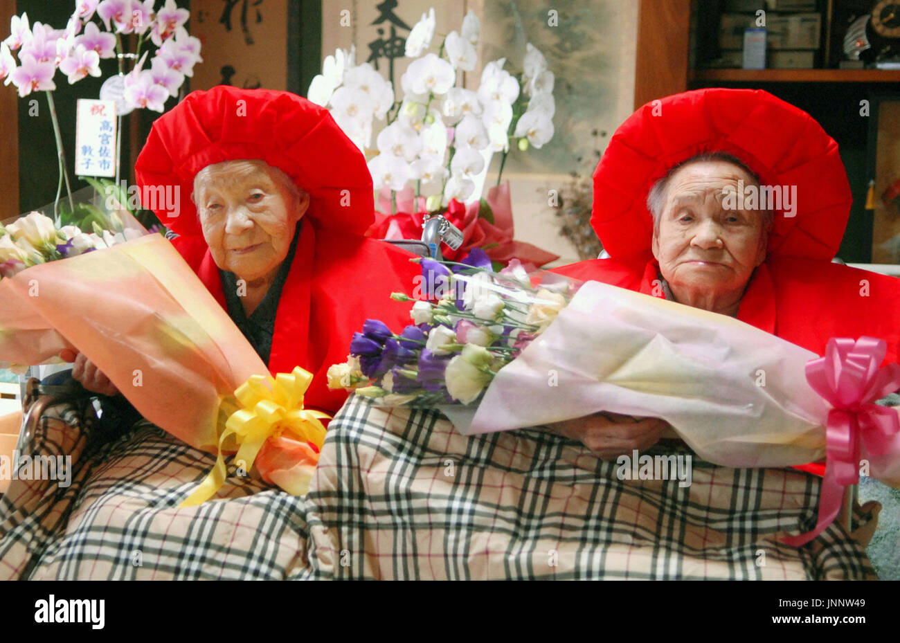 FUKUSHIMA, Japan - Female twins Tsuki Takashima (L) and Saki Takamiya ...