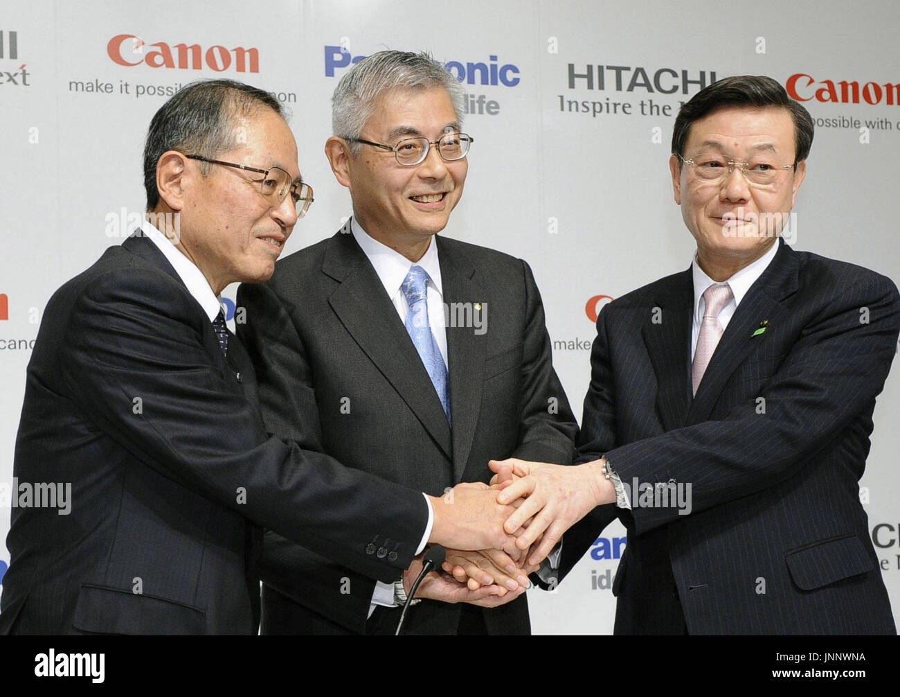 TOKYO, Japan - (From L to R) Canon Inc. President Tsuneji Uchida ...