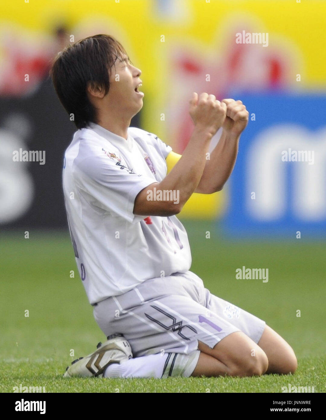 FUKUROI, Japan - Japan striker Hisato Sato falls on his knees in joy ...