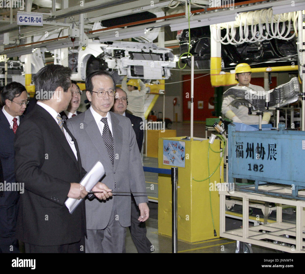 TIANJIN, China - Japanese Prime Minister Yasuo Fukuda listens to an ...