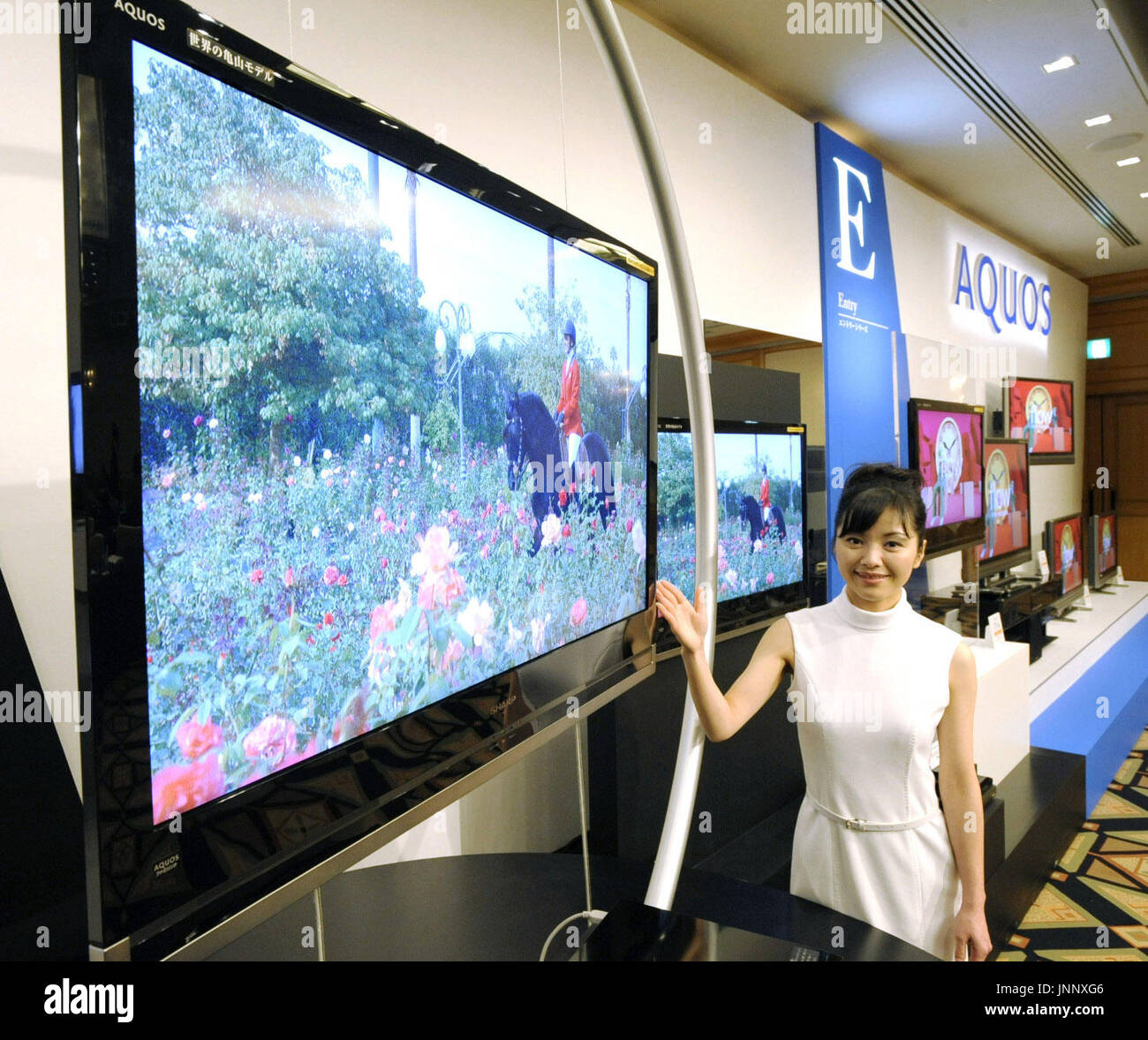 OSAKA, Japan - A model shows Sharp Corp.'s new Aquos X series of liquid ...