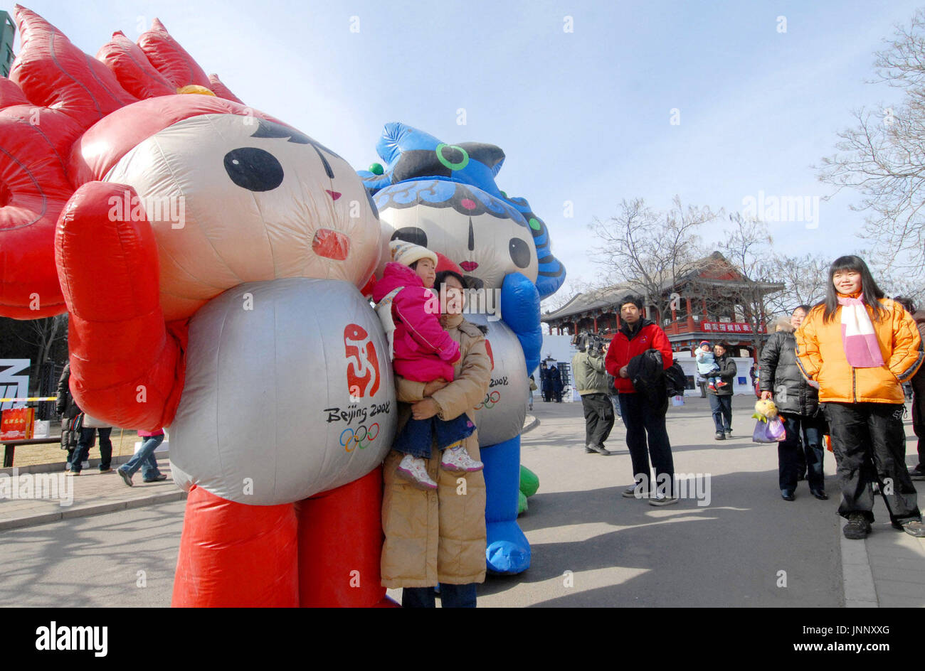 BEIJING, China - Holidaymakers pose with official mascots of the ...